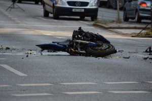 Driver charged after motorcycle rider seriously injured in crash on ...