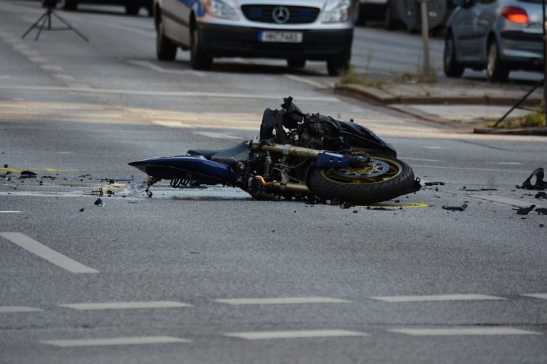 Driver charged after motorcycle rider seriously injured in crash on ...
